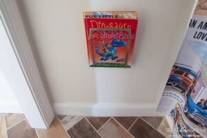 DIY wall mounted magazine rack for less than $5 - The Heathered Nest