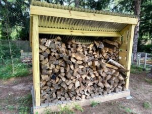 21 BEST Firewood Storage Ideas To DIY or Buy!
